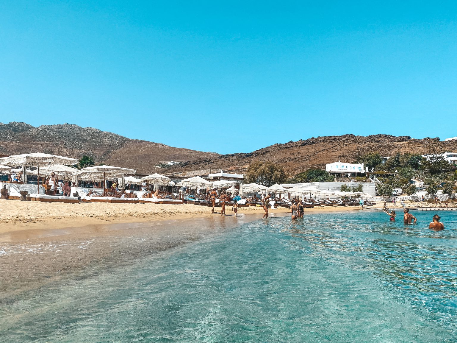WHERE TO PARTY IN MYKONOS: MYKONOS' BEST BEACH CLUBS – Travel With Pau